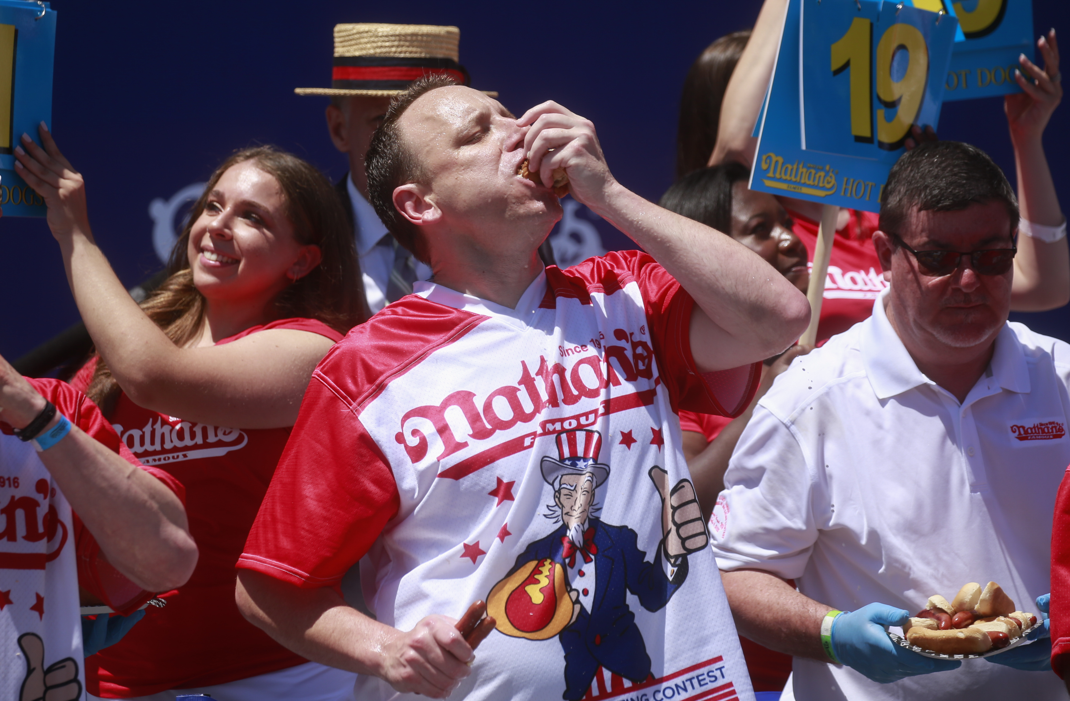 Joey Chestnut Slings Protestor During Nathan s Hot Dog Eating Contest