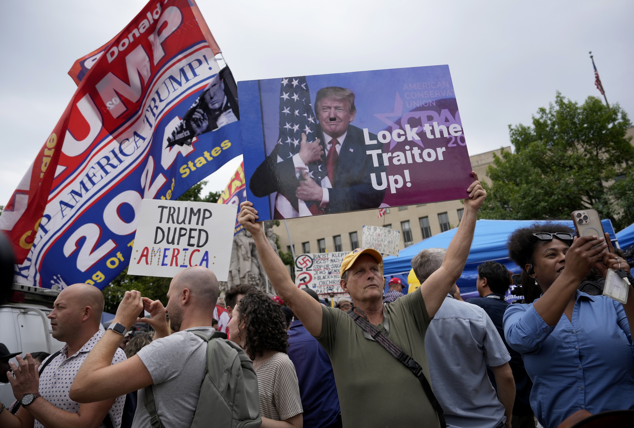 Donald Trump Supporters Stomp on Ron DeSantis Flag Outside Court ...