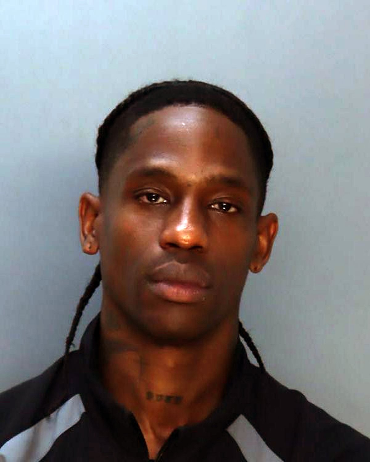 Rapper Travis Scott selling T-shirts featuring his mugshot after his ... Rapper Travis Scott selling T-shirts featuring his mugshot after his ...