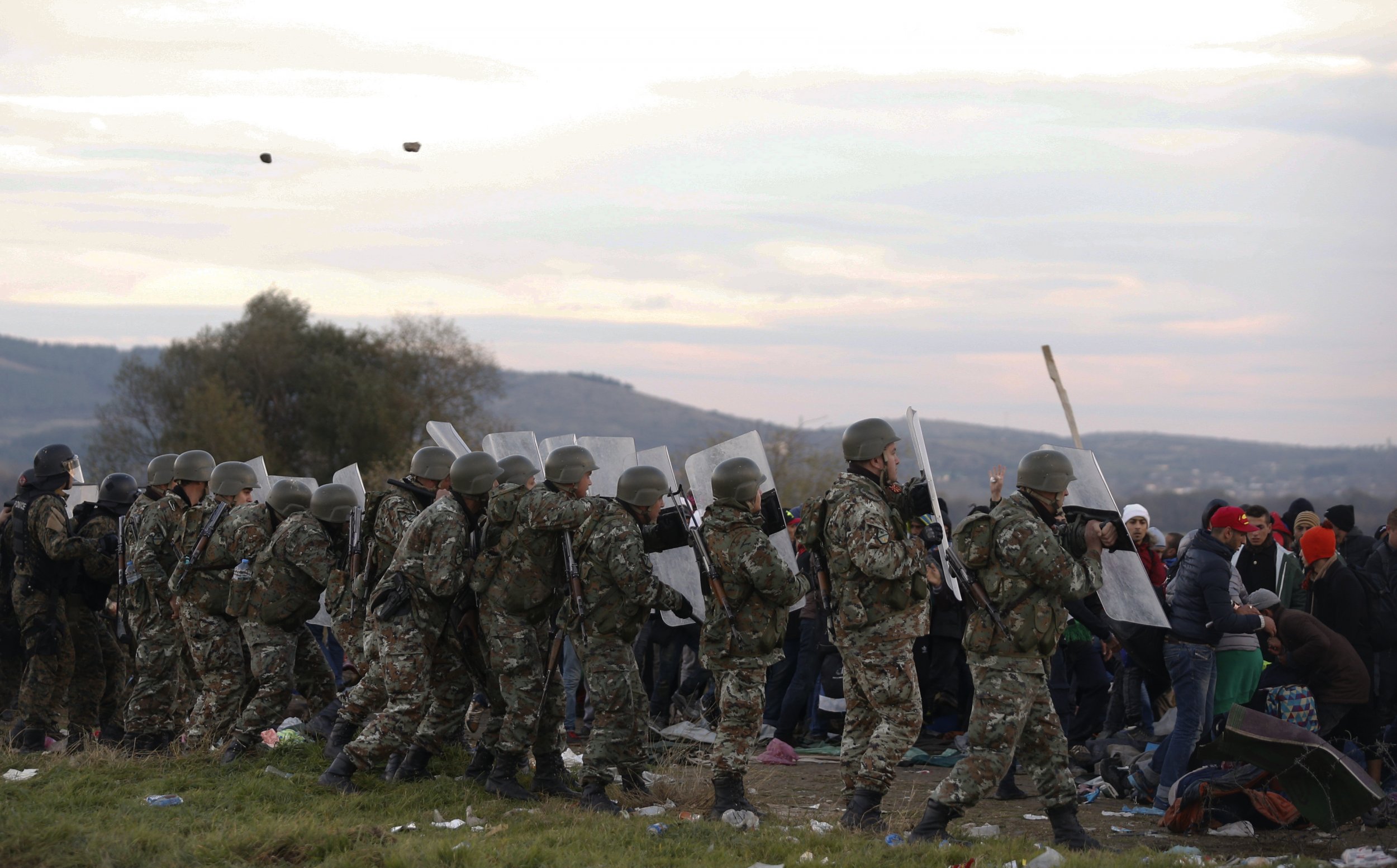 Stranded Migrants Storm Greek-Macedonia Border Fence - Newsweek